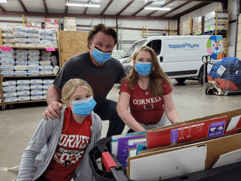 Students and alumni package diapers for families in need - Alumni ...
